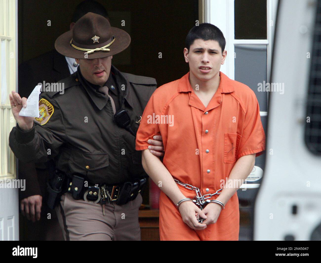 FILE - In this Dec. 1, 2009 file photo, Autumn Savoy is escorted out of ...