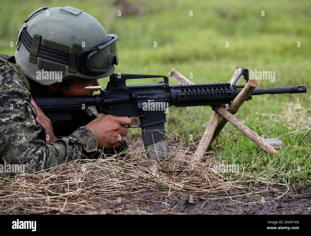 A member of the Philippine Army Light Reaction Regiment test fires his ...