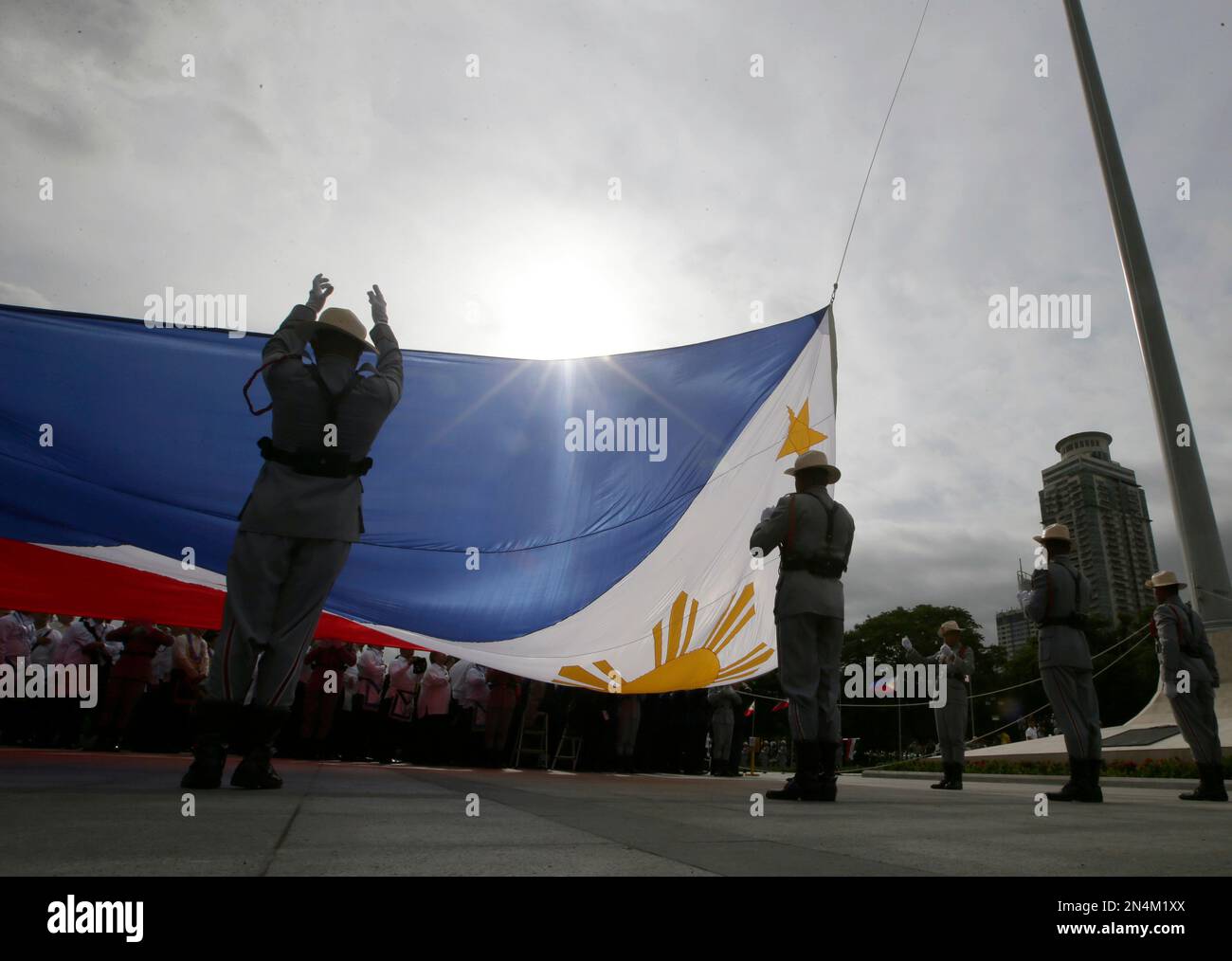 Philippine Marines, dressed as Filipino revolutionaries, raise a giant ...