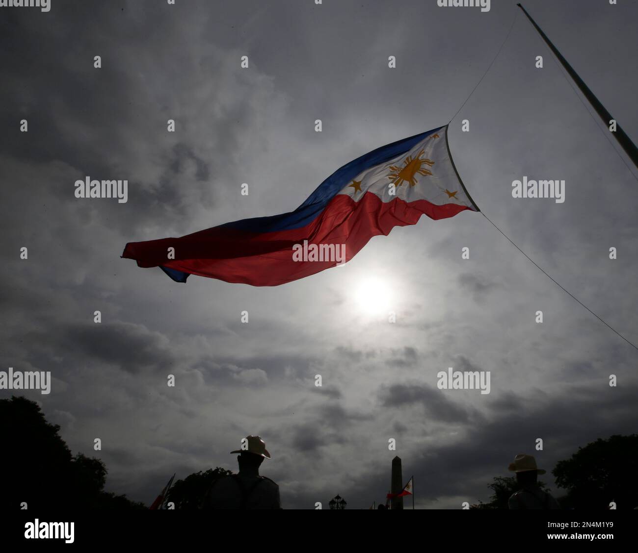 A giant Philippine flag is raised by Philippine Marines during a ...