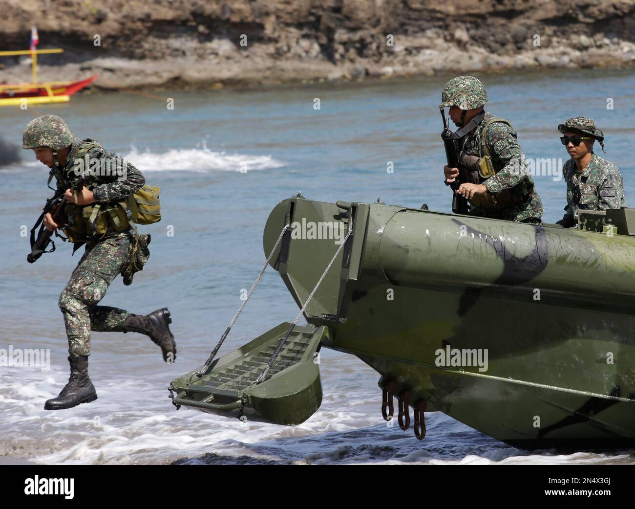 Philippine Marines exit a U.S.-made fast craft as they assault a target ...