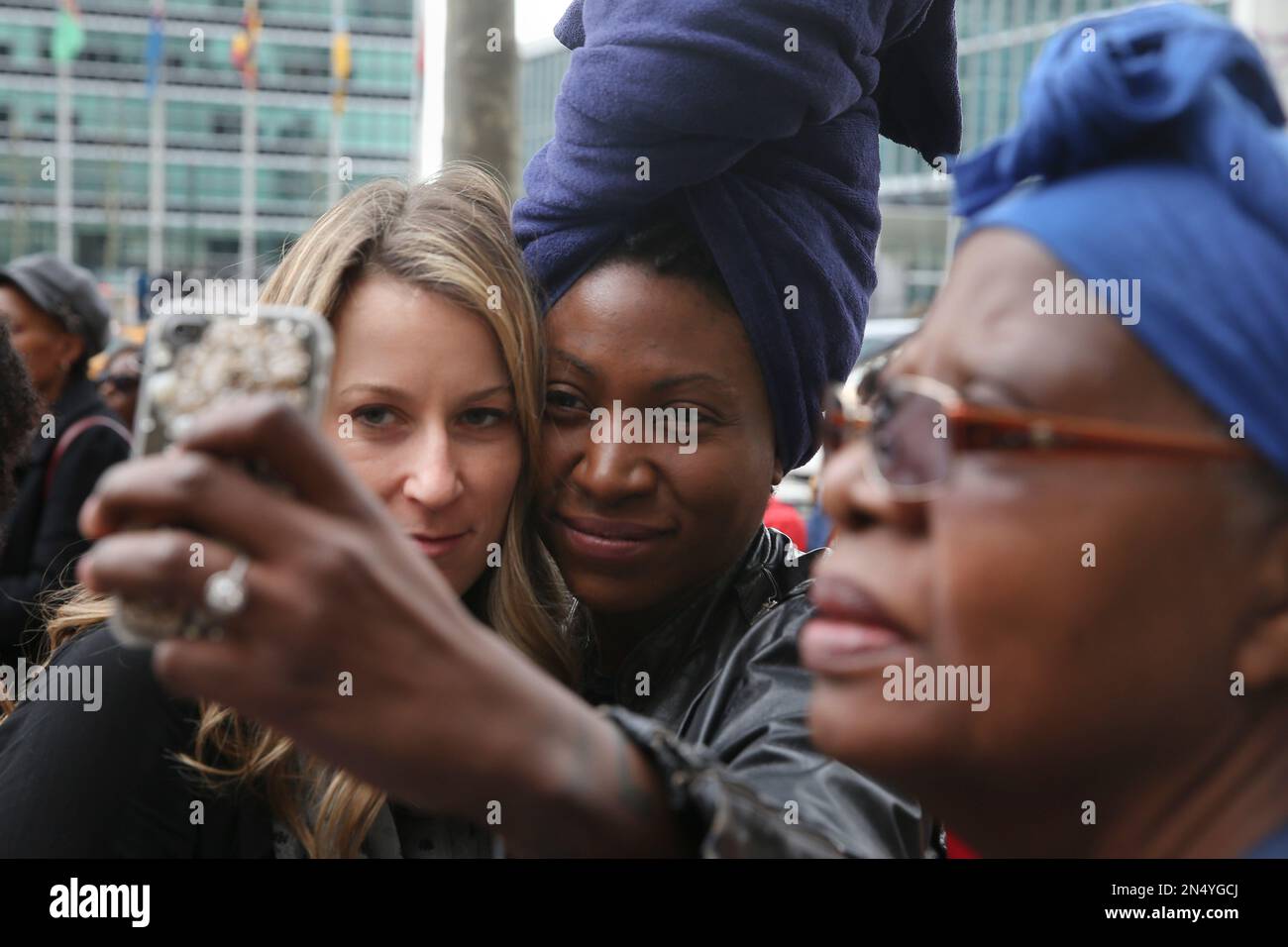 Celebrity activist Africa Byongchan Yoon, nee Engo, center, takes a ...