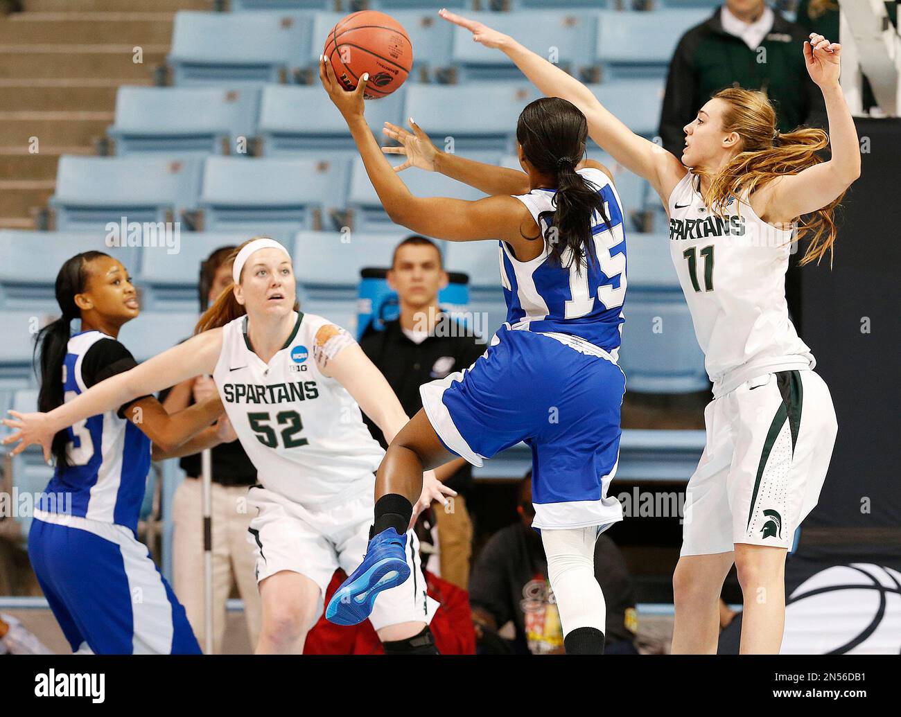 Hampton's Ryan Jordan (15) goes to the basket against Michigan State's ...