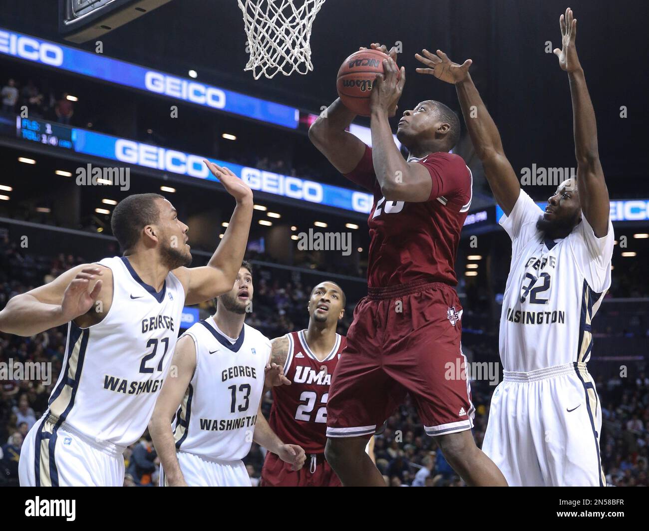 UMass center Cady Lalanne (25) shoots against George Washington forward ...