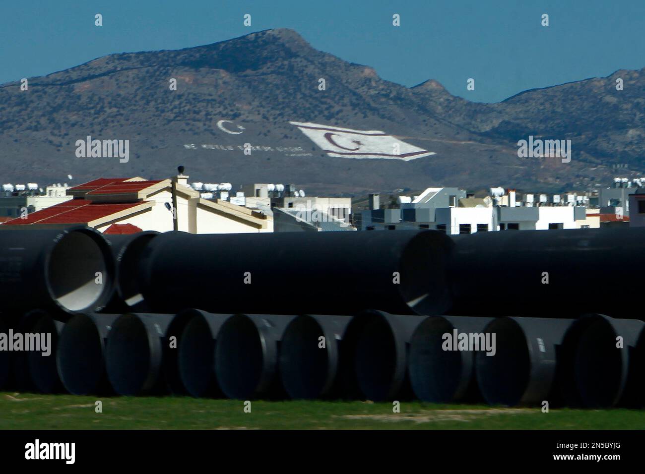 In this Wednesday, Feb. 5, 2014, a pile of iron pipeline segments rests ...