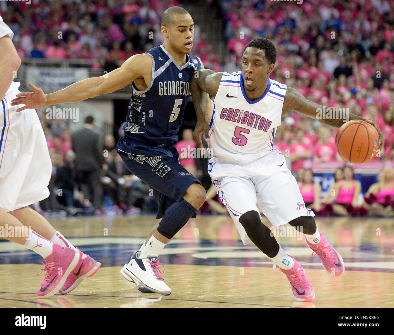 Creighton guard Devin Brooks, right, drives to the basket as he's ...