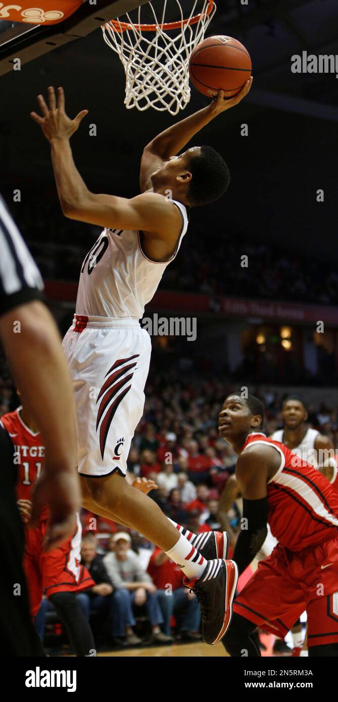 Cincinnati guard Troy Caupain goes up for a basket against Rutgers ...