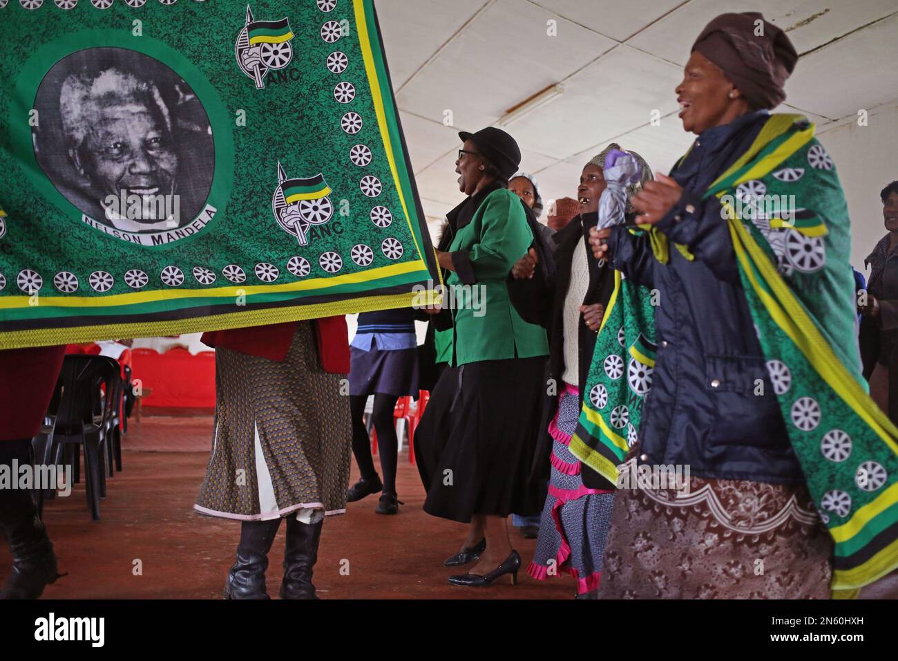 People sing and dance as they celebrate the live of former South ...