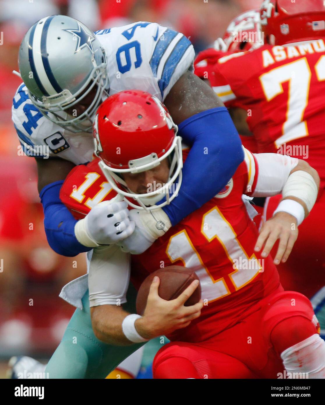 Kansas City Chiefs quarterback Alex Smith (11) is sacked by Dallas ...