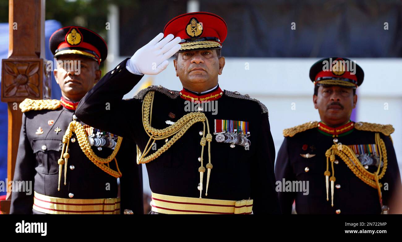 Sri Lankan army commander Lt. Gen. Jagath Jayasuriya, center, salutes ...