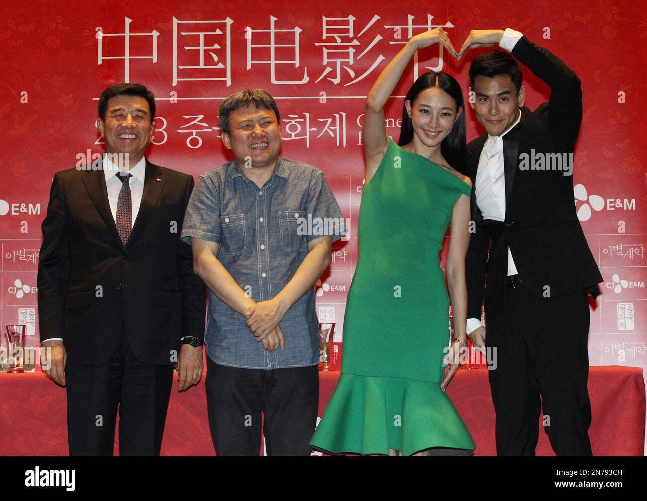 Chinese actress Bai Bai He and Taiwanese actor Eddie Peng gesture ...