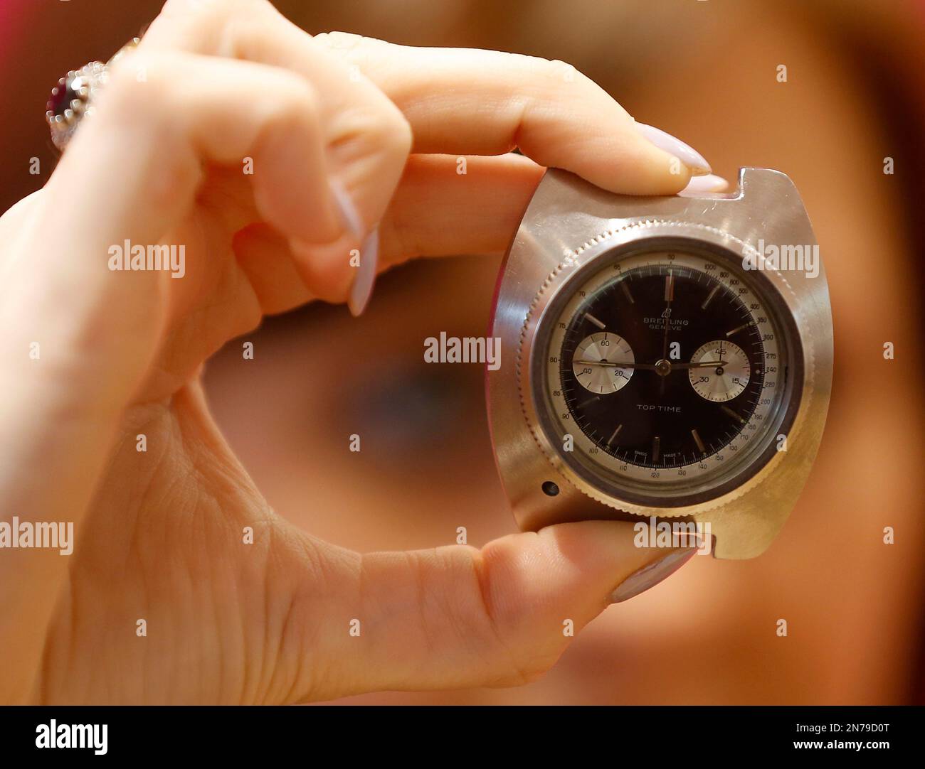 A Christie's employee shows the first watch adapted for James Bond by ...