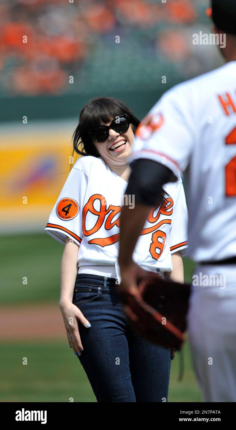 Canadian recording artist Carly Rae Jepsen reacts after throwing out ...