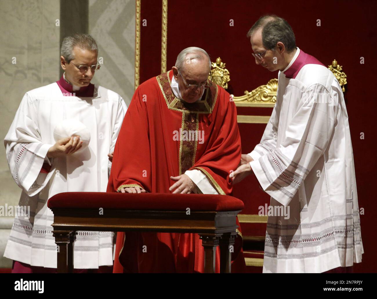 Pope Francis is assisted by Mons. Guido Marini, right, Master of ...