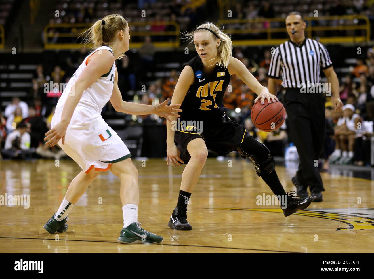 Iowa guard Jaime Printy, right, dribbles in front of Miami guard ...