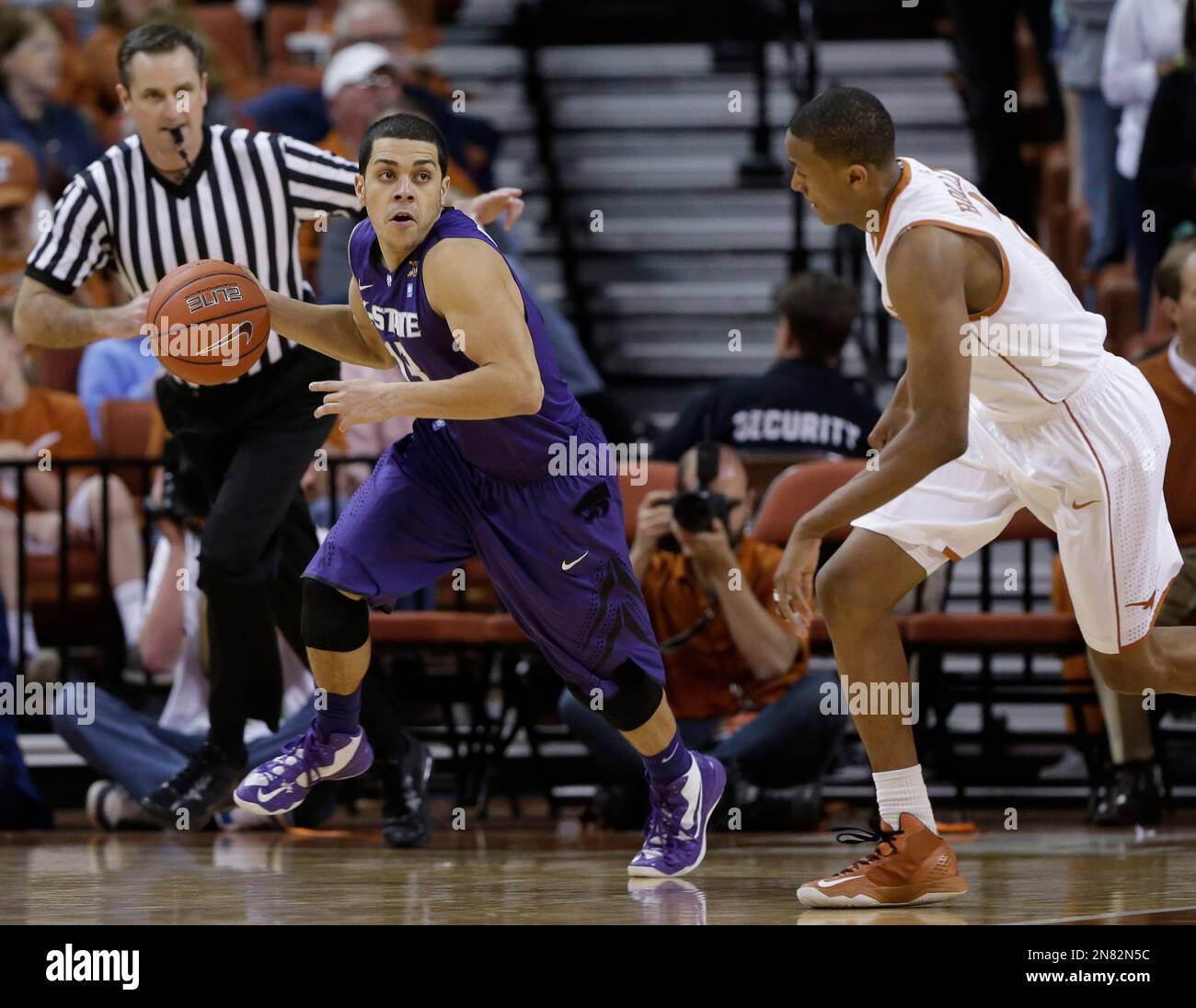 Kansas State's Angel Rodriguez, left, drives around Texas' Demarcus ...