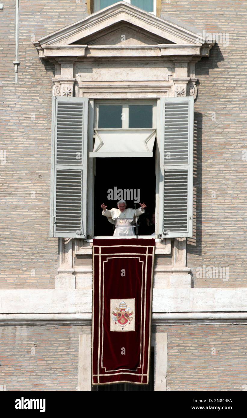 Pope Benedict XVI greets the faithful during the angelus prayer in St ...