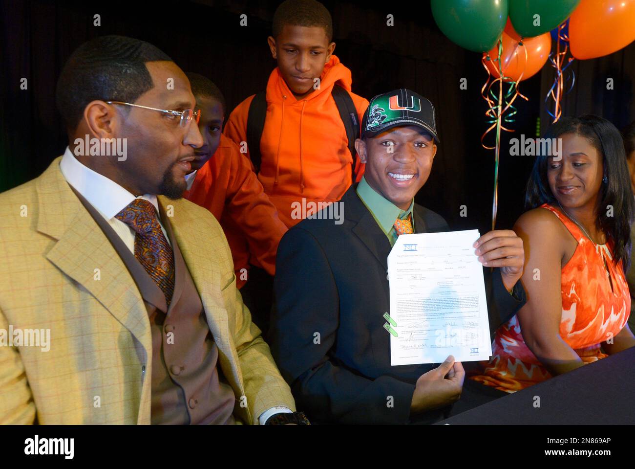 Ray Lewis III, second from right, shows his national letter-of-intent ...