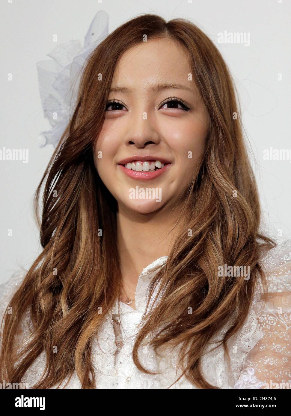 Tomomi Itano, a member of Japanese girls pop gourp AKB48, poses for photographers at the opening ...