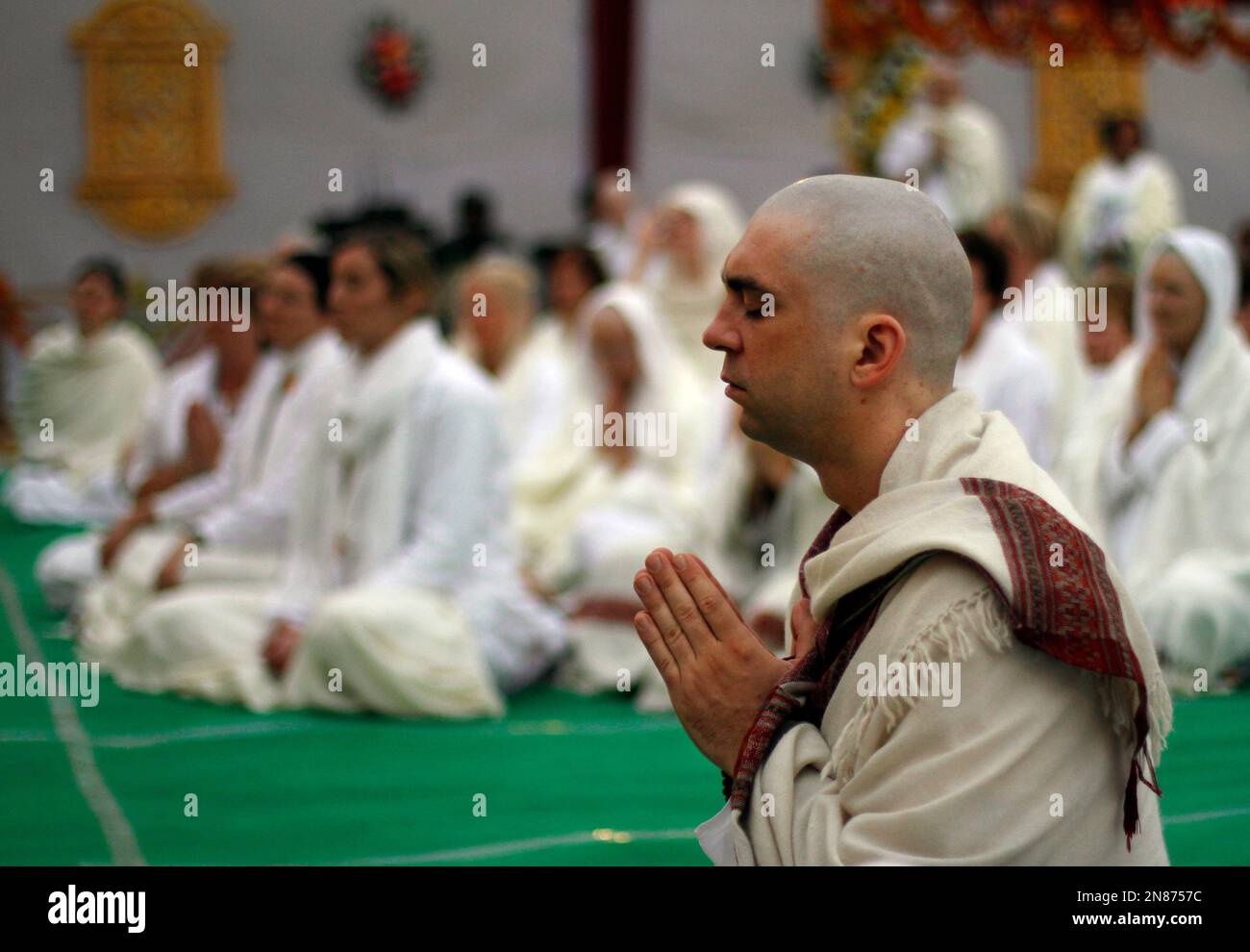 In this Thursday, Jan. 31, 2013 photo, foreign devotees of Hindu holy ...