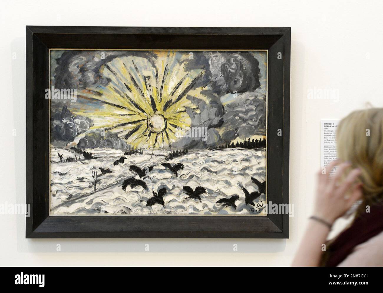 A visitor stands in front of the painting 'Sunrise' (1913, Oil on ...