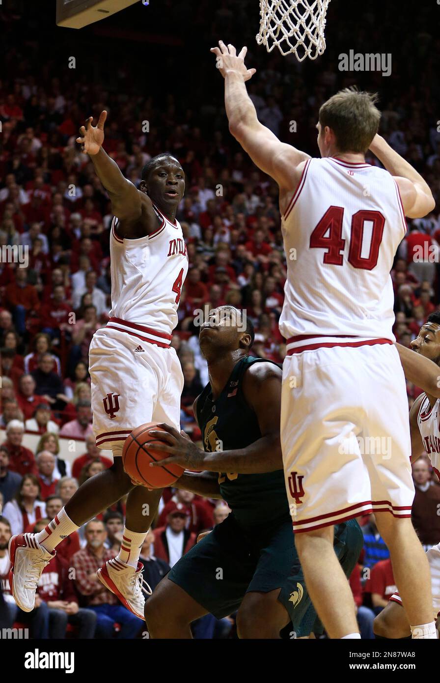 Michigan State's Derrick Nix, center, puts up a shot against Indiana's ...