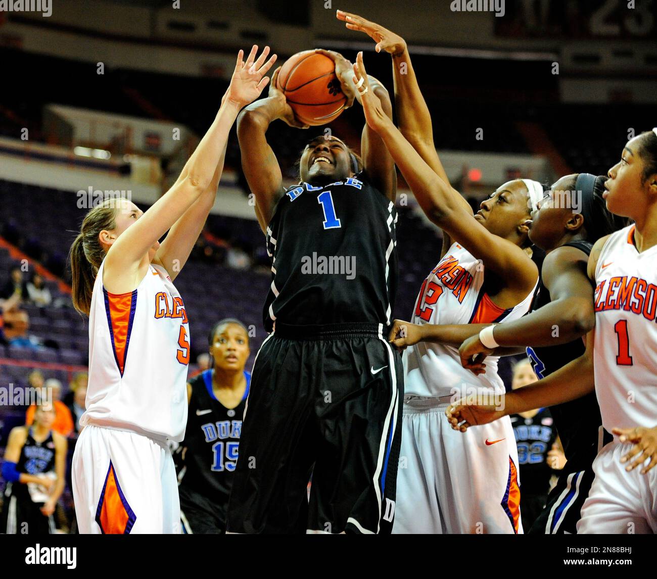 Duke's Elizabeth Williams, center, shoots while being pressured by ...