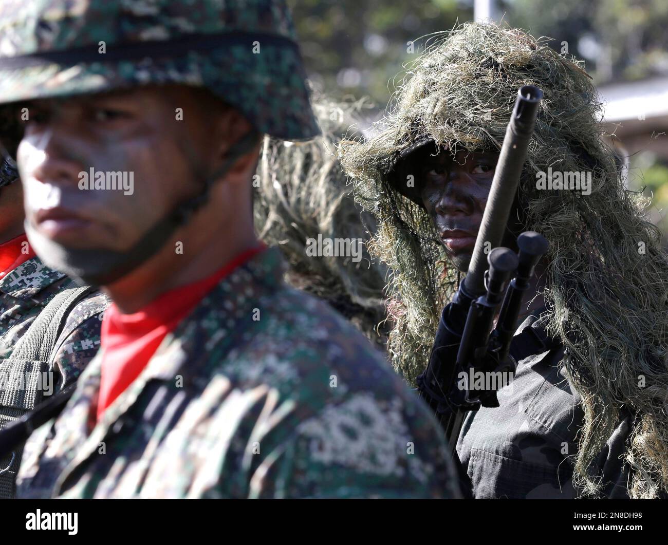 Soldiers, including sniper units of the Philippine Army, prepare to ...