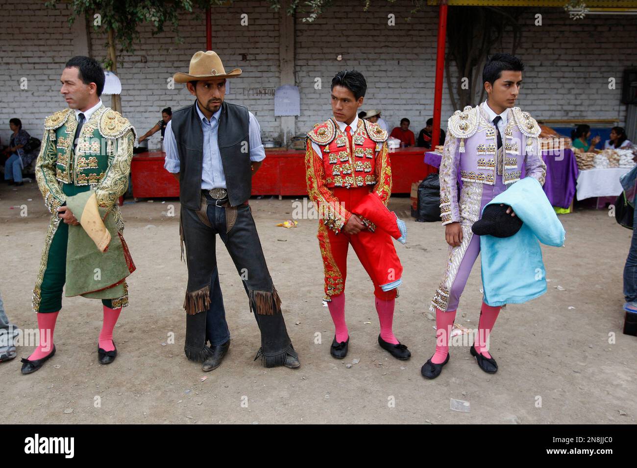 From right to left, bullfighters Kervin Fernandez, Brayan Quinonez ...