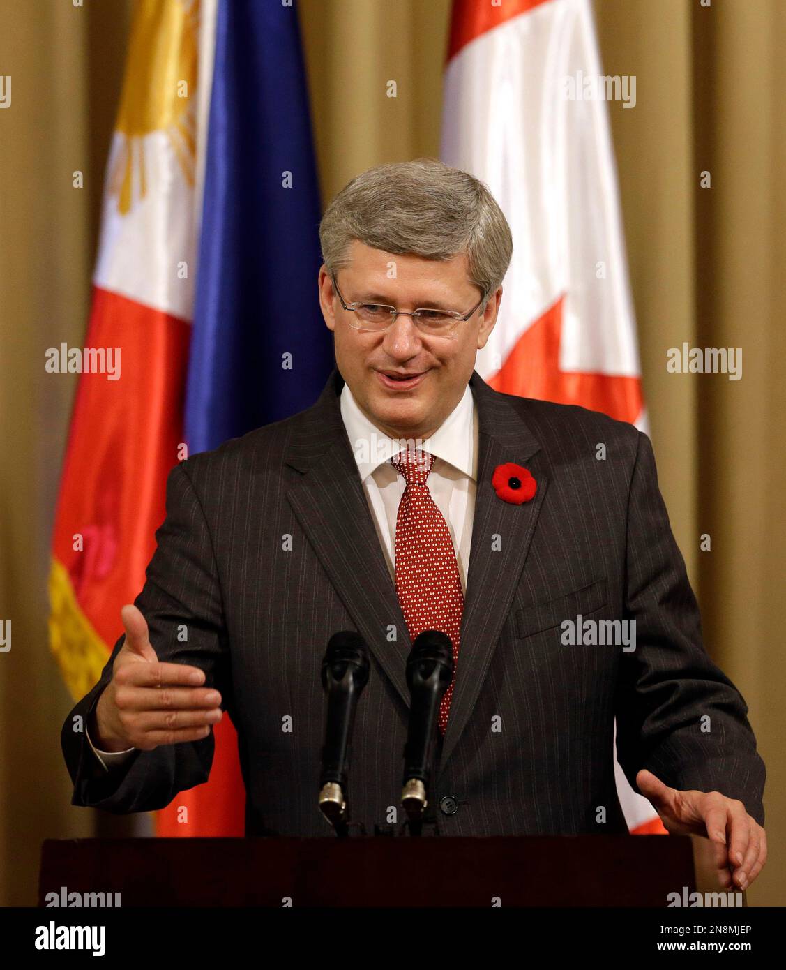 Visiting Canadian Prime Minister Stephen Harper gestures during a joint ...