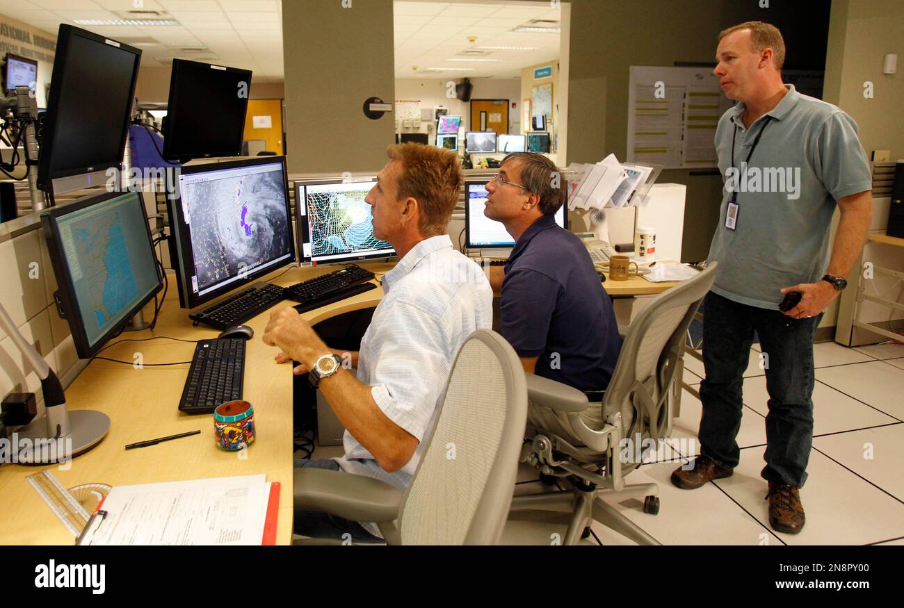 Marine forecaster Scott Stripling, left, meteorologist Chris Landsea ...