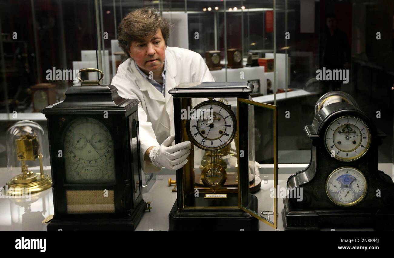 Conservator Richard Horton poses for the media as he adjusts a French ...