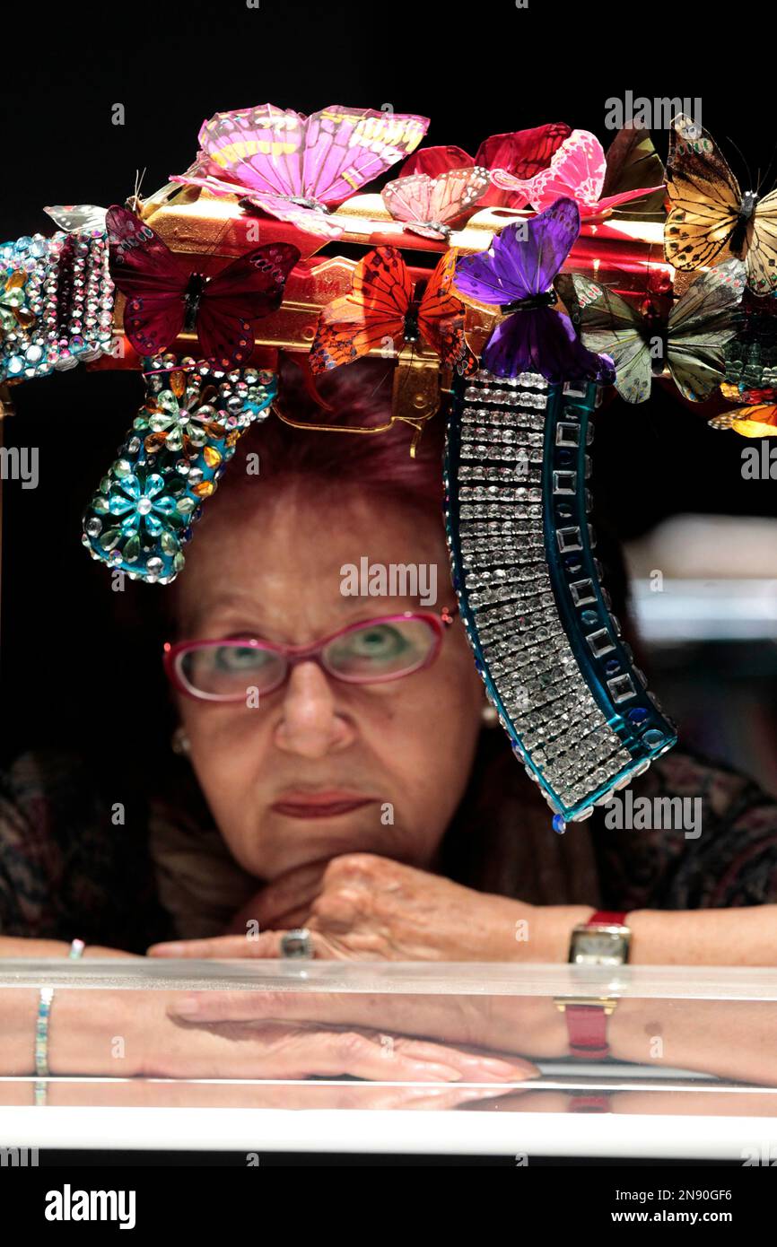 Gaza-born Palestinian artist Laila Shawa poses by her interpretation of ...