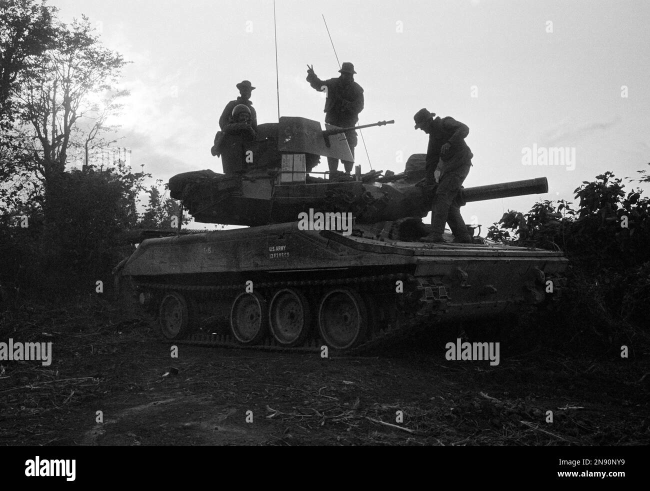 A U.S. soldier flashes a V-sign from a Sheridan tank as the Americal ...
