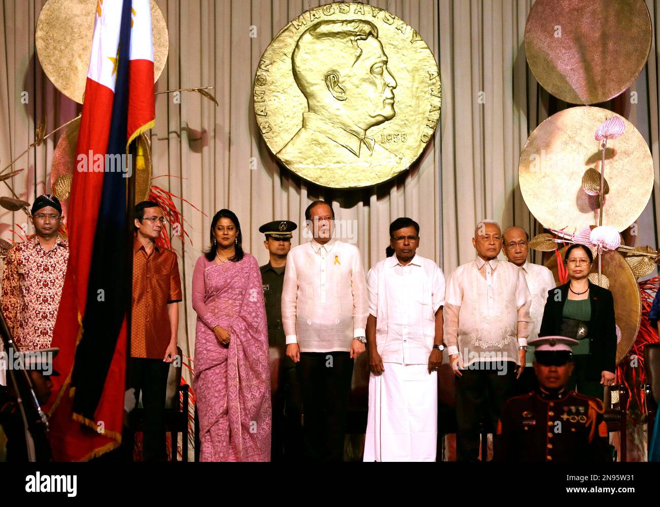 Recipients of this year's Ramon Magsaysay Awards pose with Philippine ...