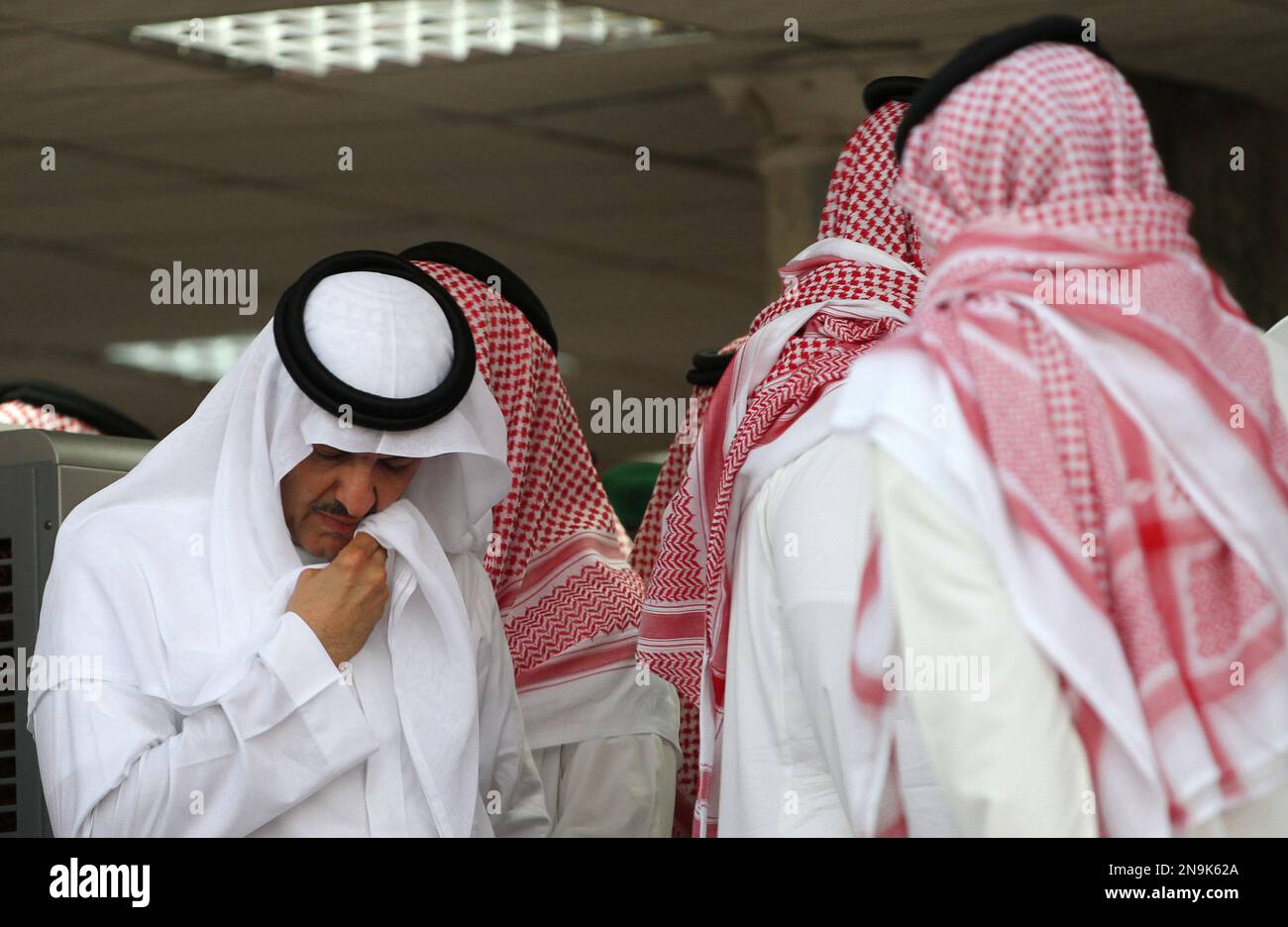 Prince Sultan bin Salman bin Abdul-Aziz Al Saud, left, cries during the ...
