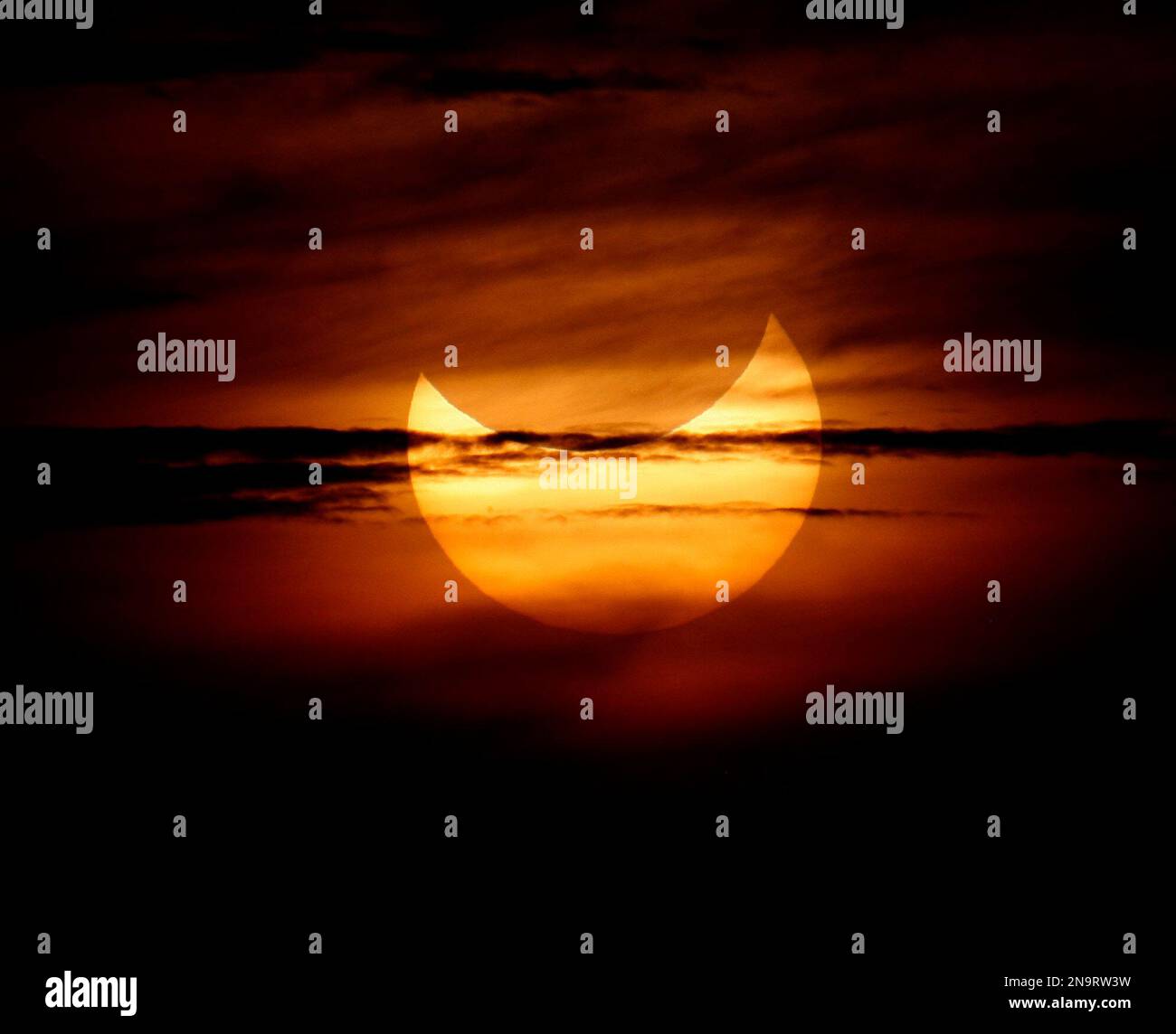 An annular solar eclipse is partially seen at sunrise Monday, May 21 ...