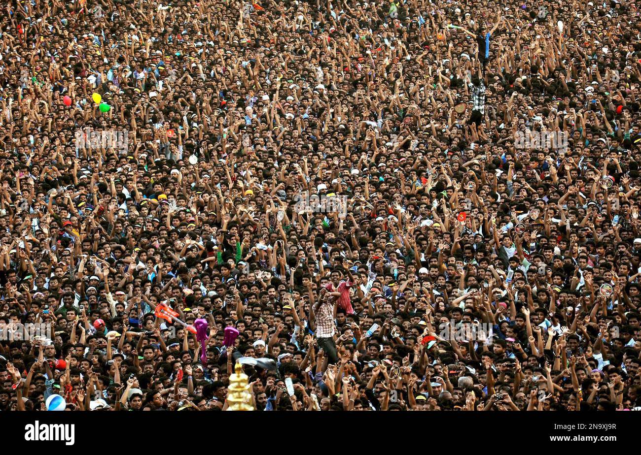 People react as they watch the 'Kudamattam' or the umbrellas changing ...