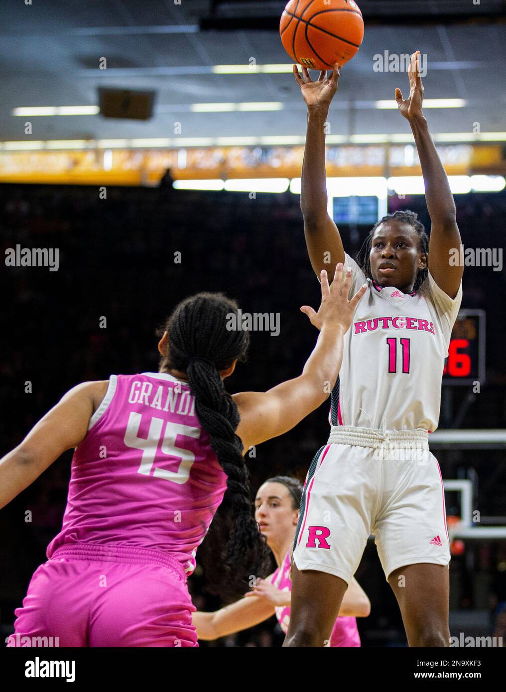Iowa forward Hannah Stuelke (45) reaches out to block Rutgers guard Awa ...