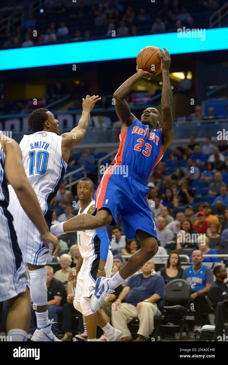 Detroit Pistons guard Walker Russell (23), right, goes up for a shot in ...