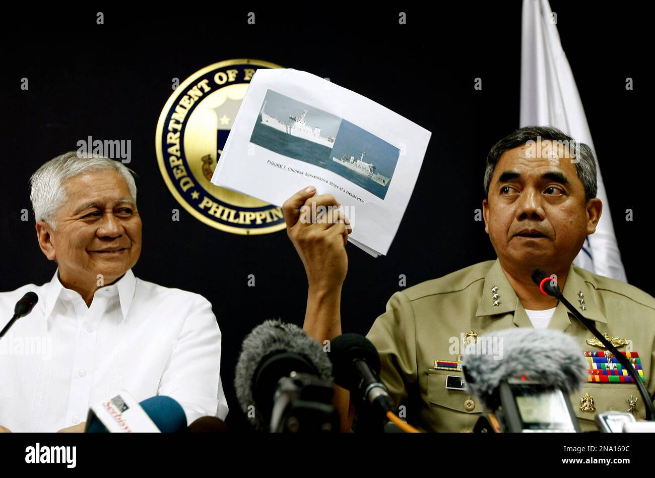 Philippine Navy Chief Vice-Admiral Alexander Pama shows photos of two ...