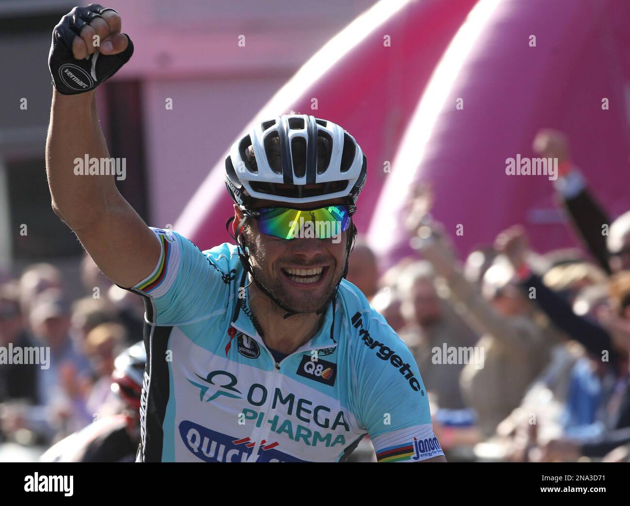 Belgium's Tom Boonen of the Omega Pharma-Quickstep team jubilates as he ...