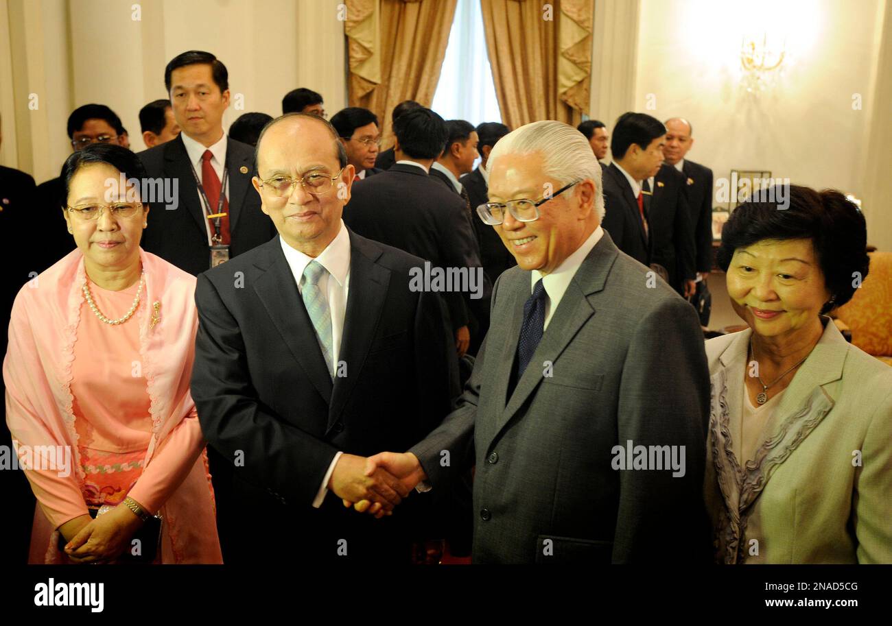 Myanmar President Thein Sein, center left, and his wife Khin Khin Win ...