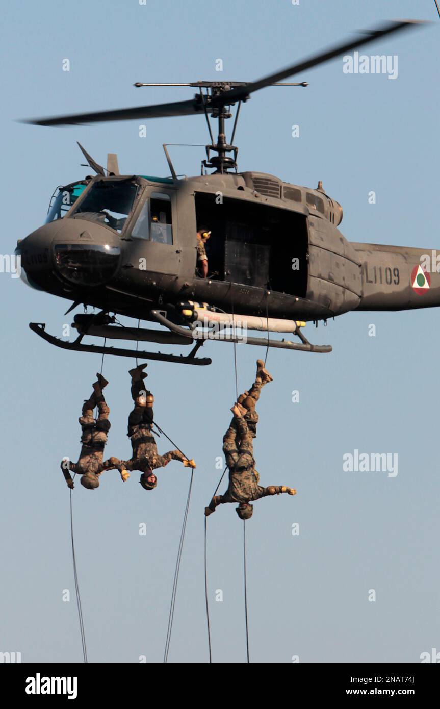Lebanese special forces soldiers descend from a helicopter as they show ...