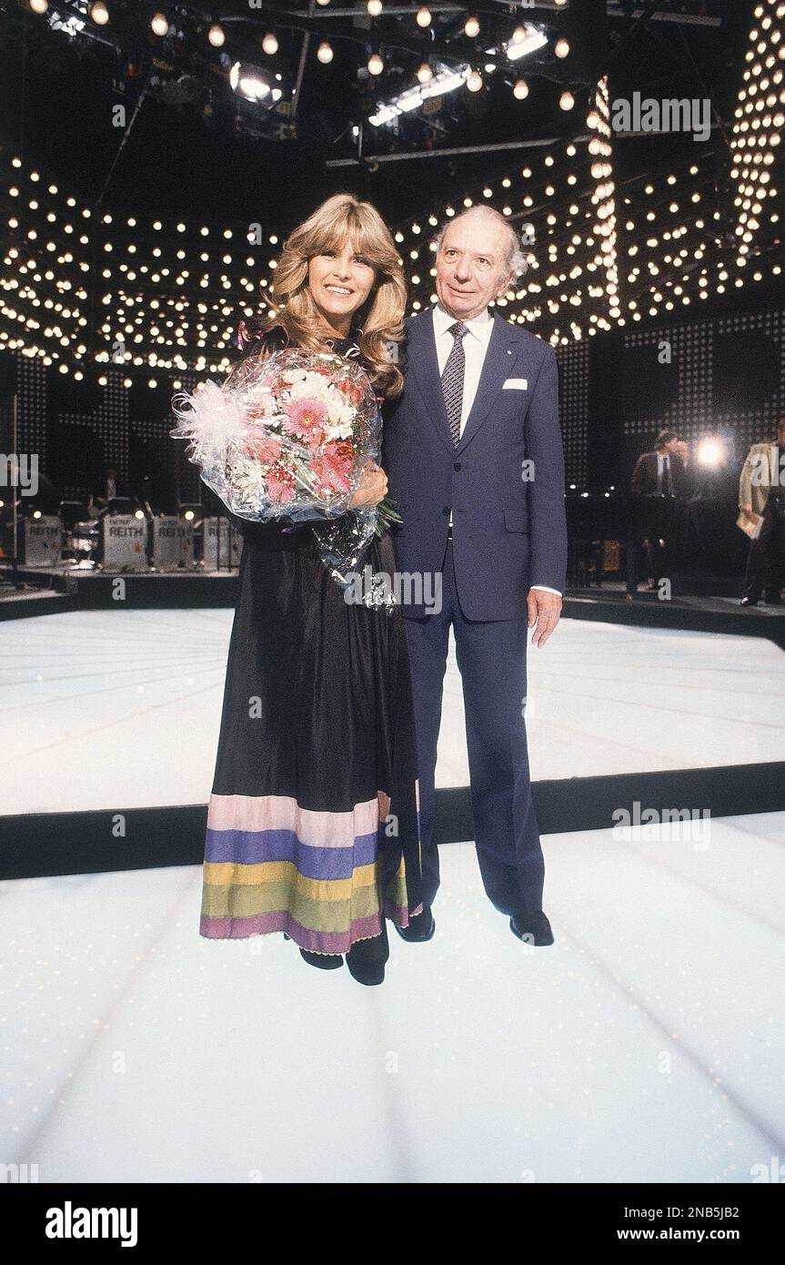 German pop singer Lena Valaitis, holding a bouquet, poses with GEMA ...