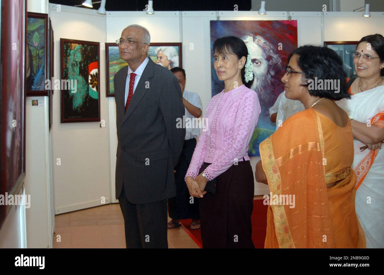 Myanmar democracy icon Aung San Suu Kyi, centre, views paintings of ...