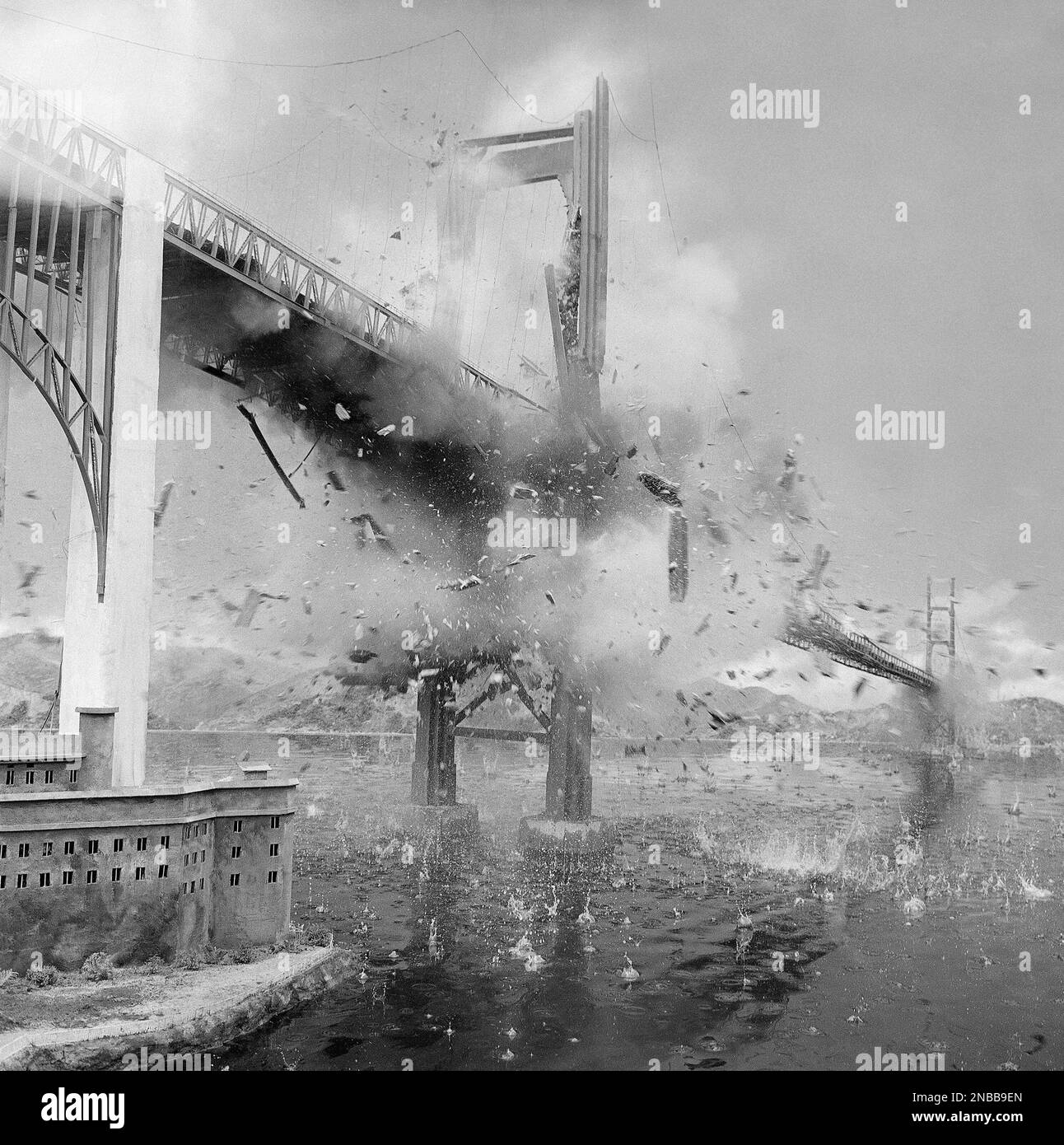 Workmen build a model of San Francisco’s Golden Gate Bridge for use in ...