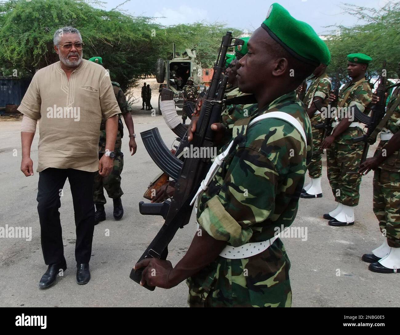 The African Union envoy to Somalia, Jerry Rawlings, inspects a guard of ...