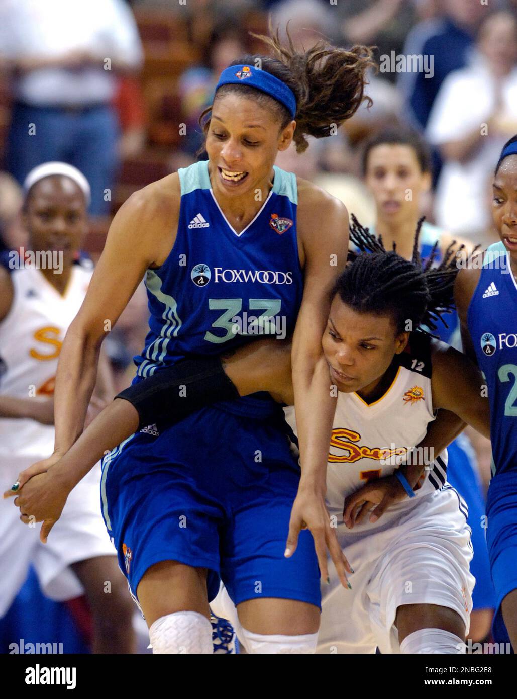 Connecticut Sun's Tan White, center, fights for a loose ball with New ...