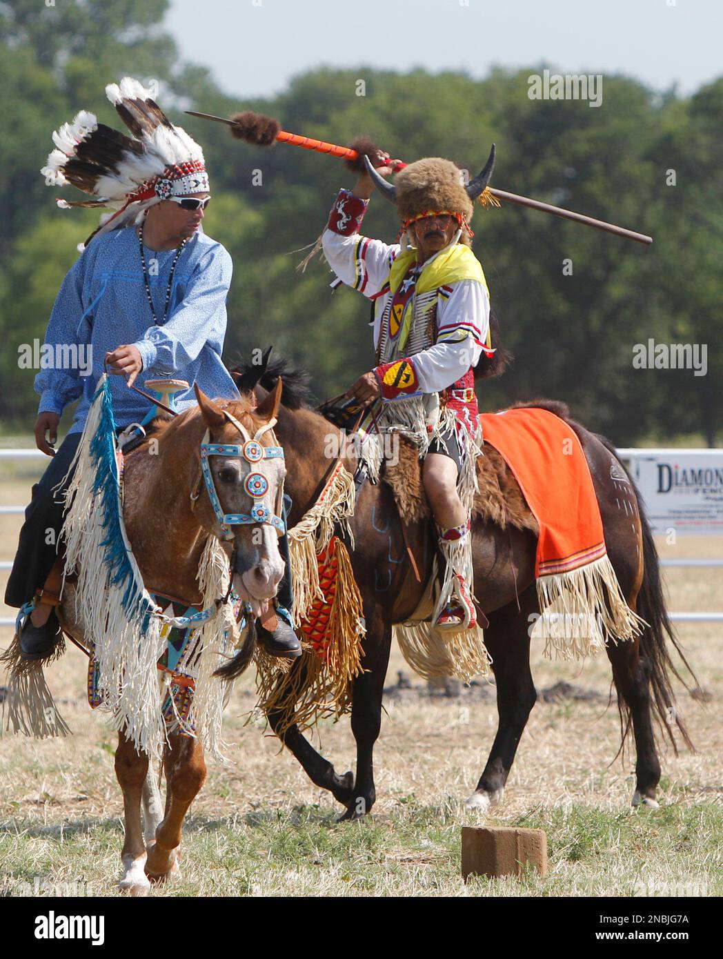 Arby Little Soldier, right, and his son Tyler Little Soldier perform a ...